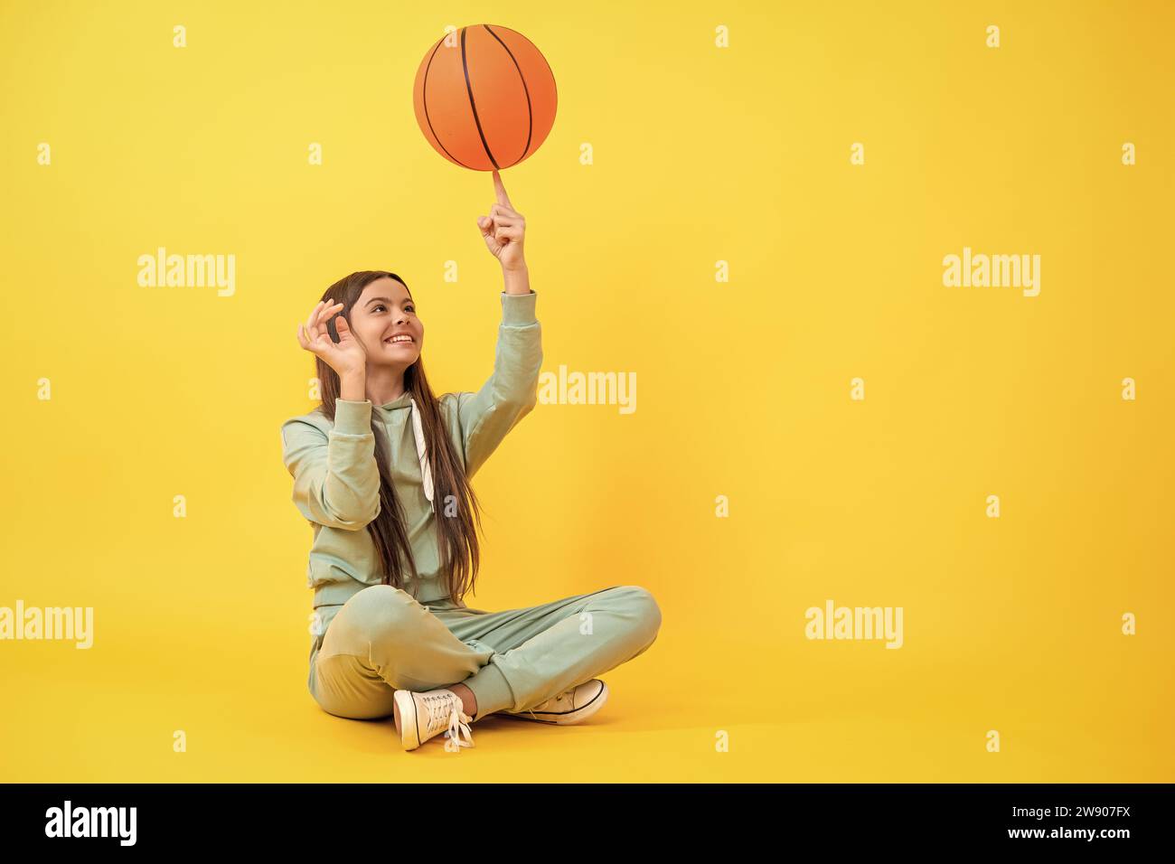 Teen girl excelling in basketball. Skilled teen girl playing the ...