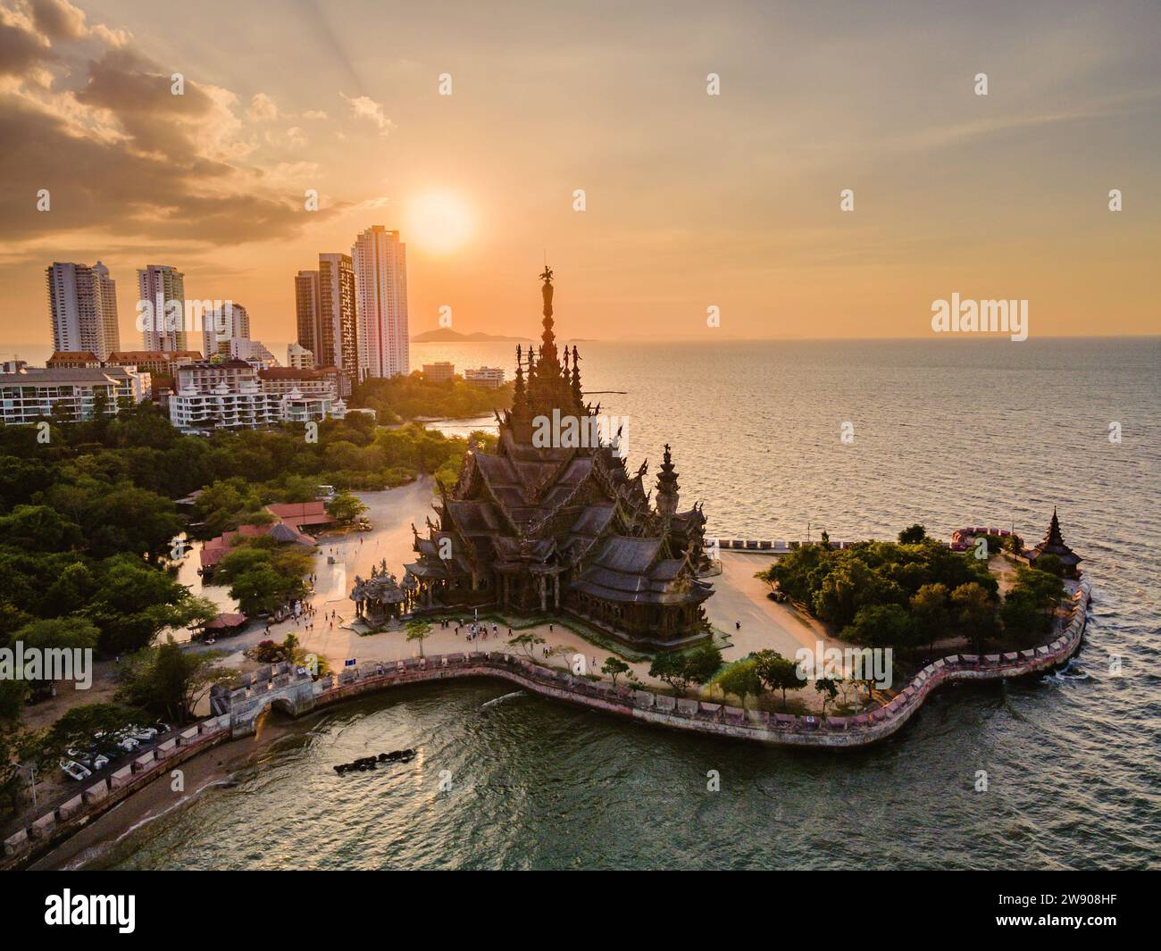 Skyline of Pattaya city at sunset with The Sanctuary of Truth wooden ...