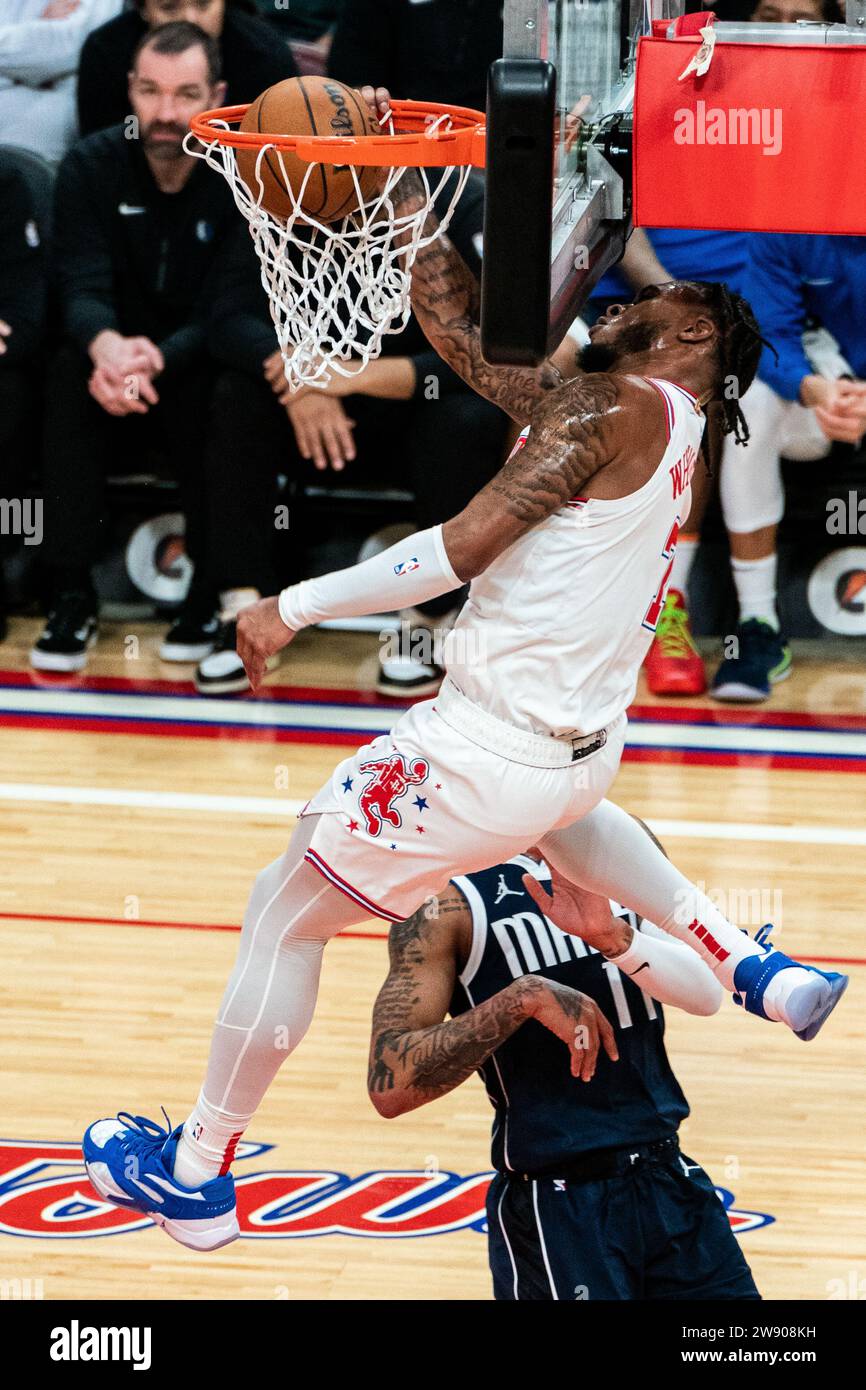 Houston, USA. 22nd Dec, 2023. Cam Whitmore (top) of Houston Rockets ...