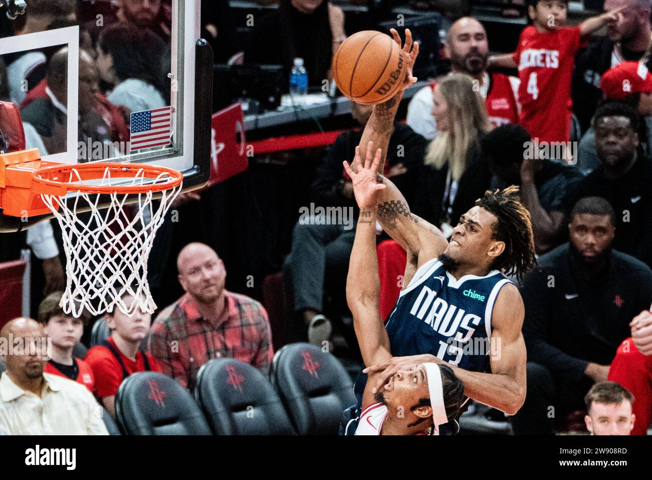 Houston, USA. 22nd Dec, 2023. Greg Brown III (top) of Dallas Mavericks ...