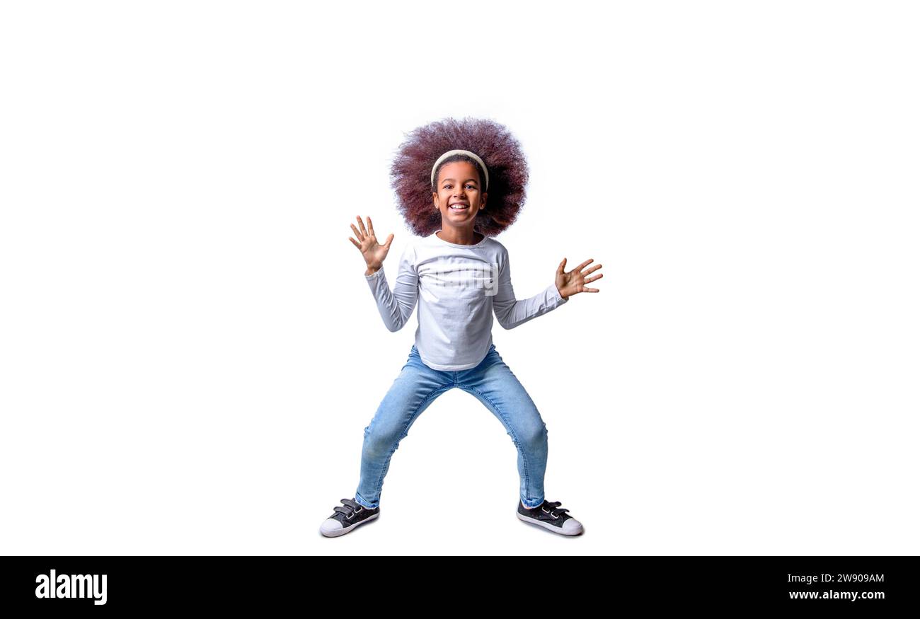 Smile african child girl jumping and celebrating isolated over white ...