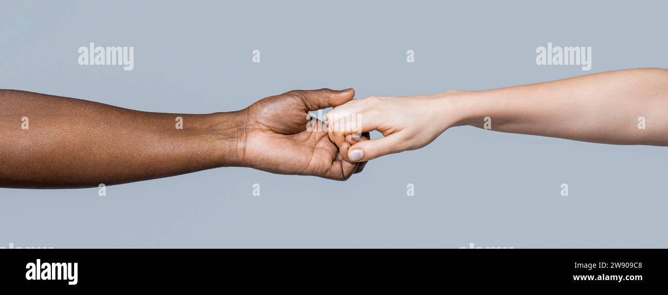Giving a helping hand to another. Woman and african woman hand. Black ...