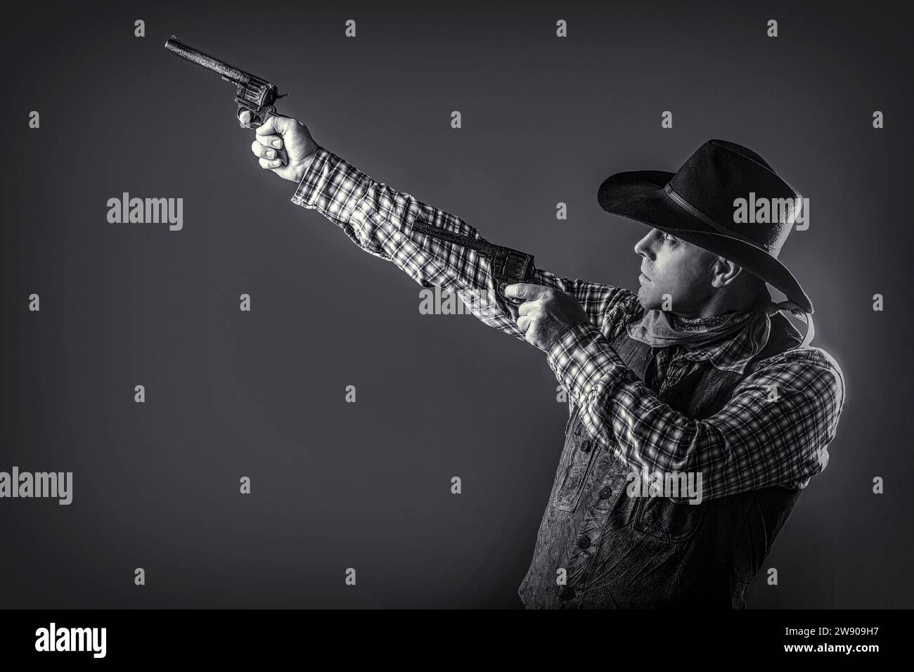 Man wearing cowboy hat, gun. Western man with hat. Portrait of a cowboy ...
