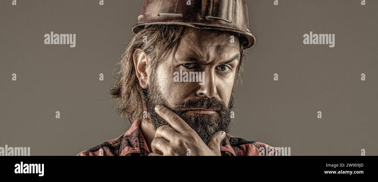 Building, industry - builder concept. Bearded man worker with beard in ...