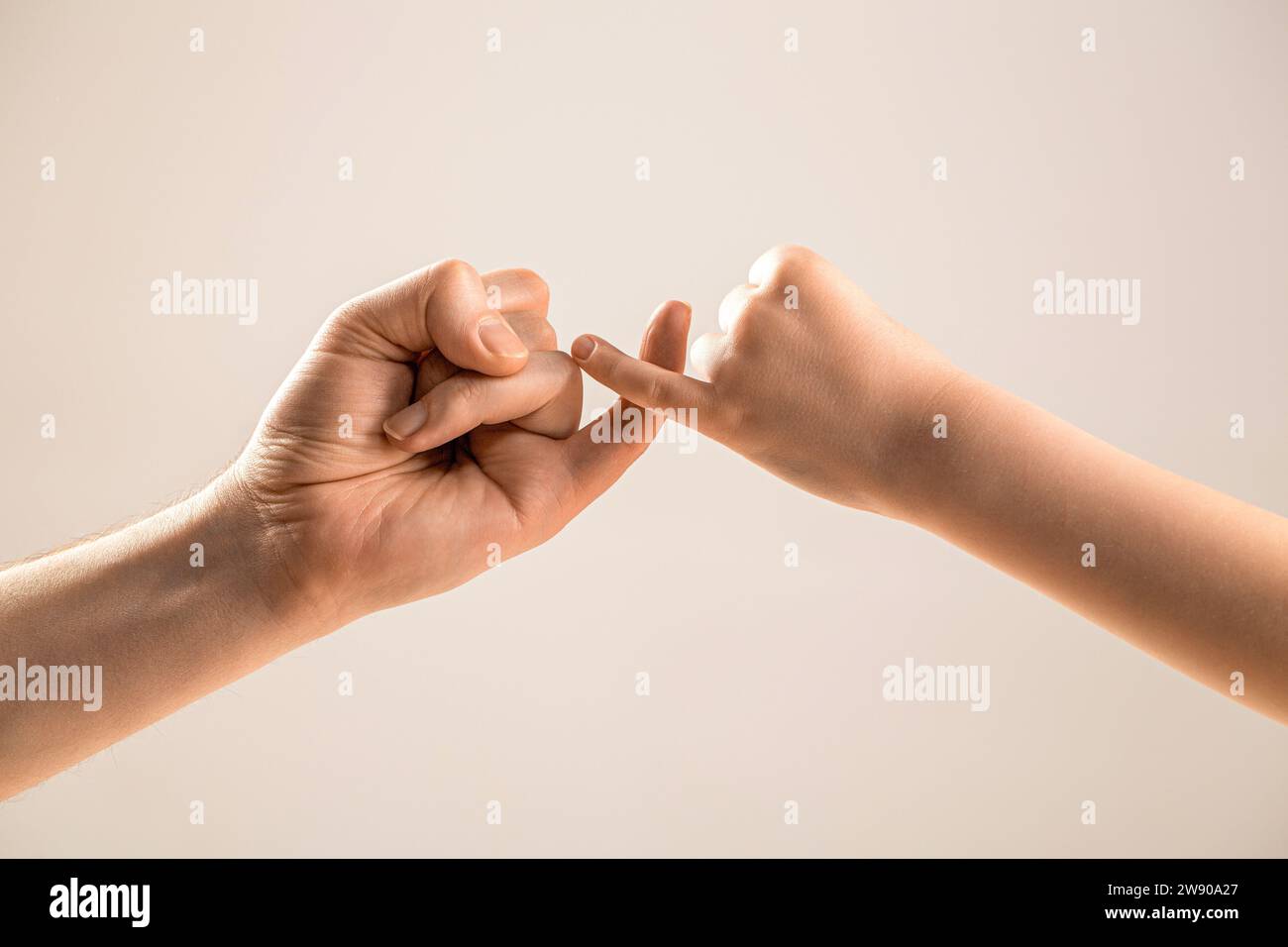 Little finger of the two hands hold together. Show friendship and ...