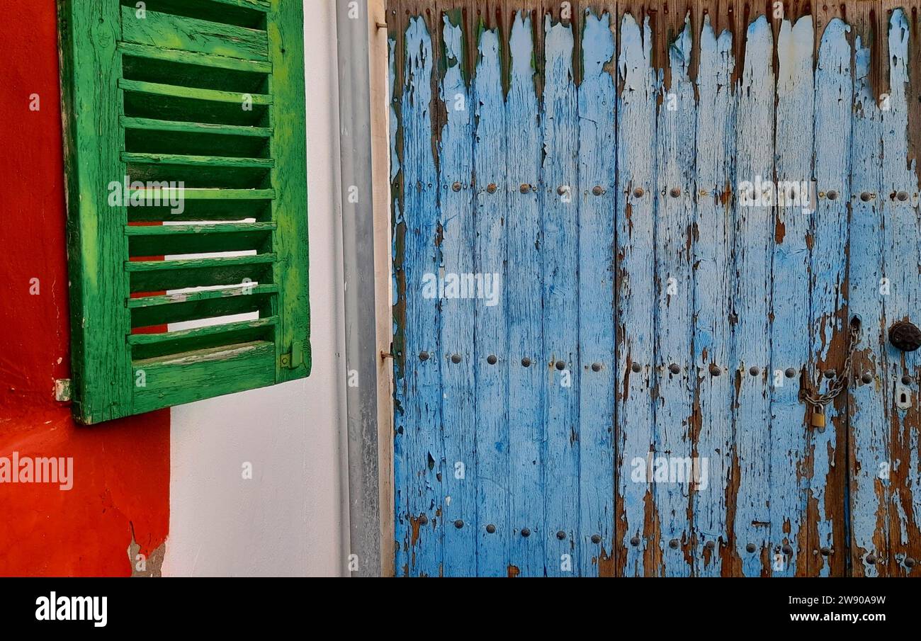 Colourful gate and window shutter Stock Photo - Alamy