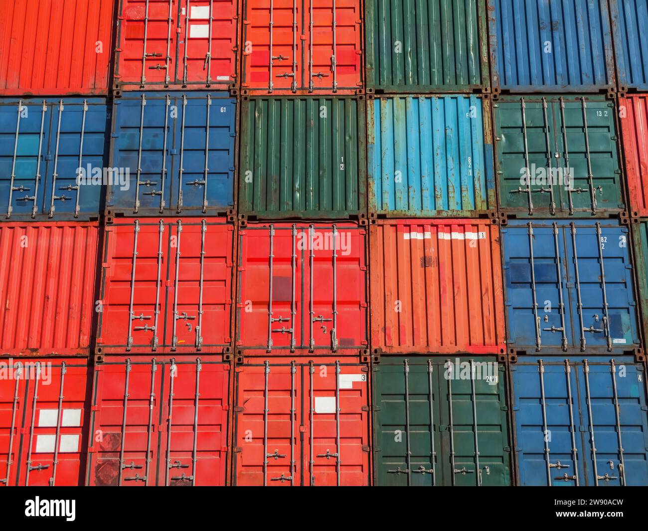 Grid pattern of a tall wall of shipping containers Stock Photo - Alamy