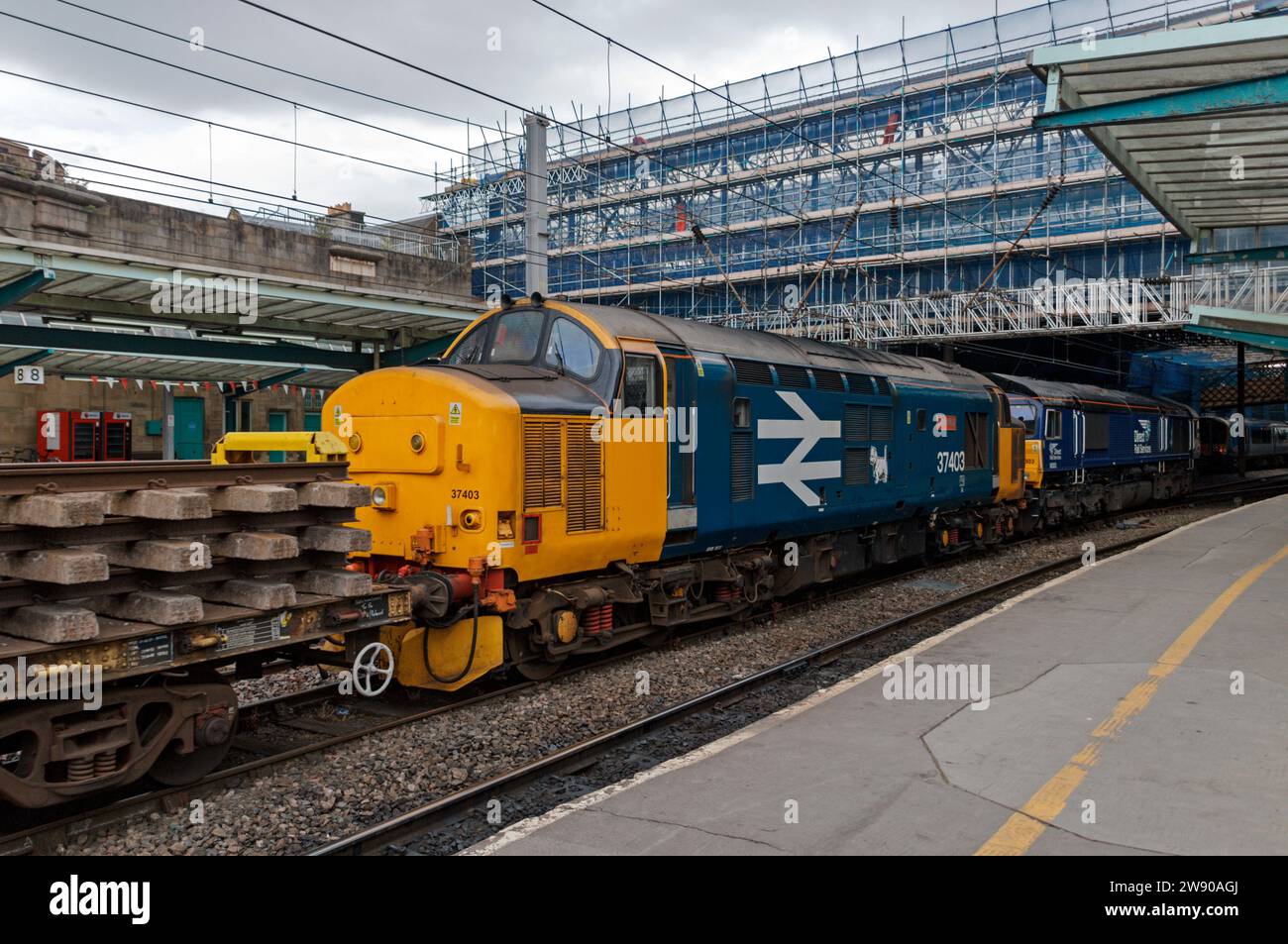 37403 working with 66303 heading through Carlisle railway station ...