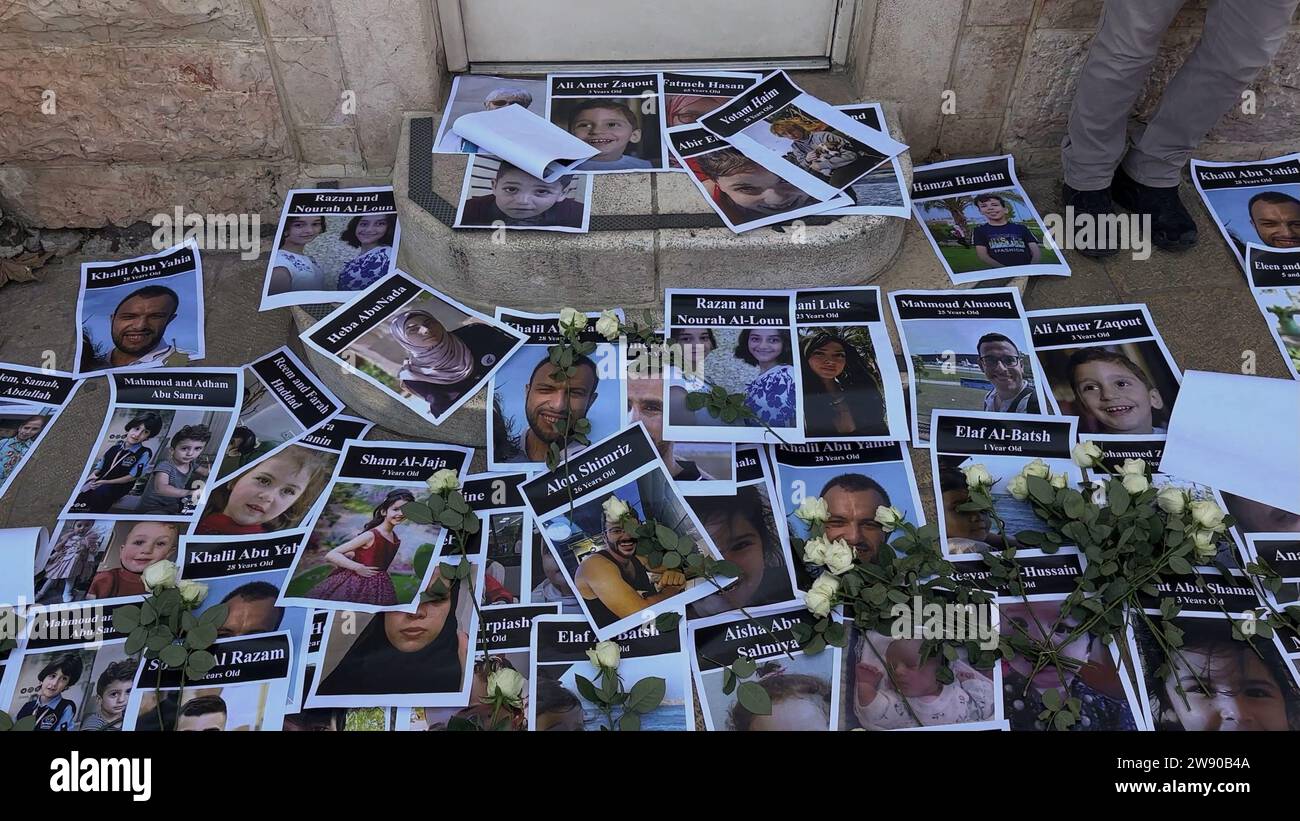 Flowers and posters with portraits of Palestinians killed by Israeli ...