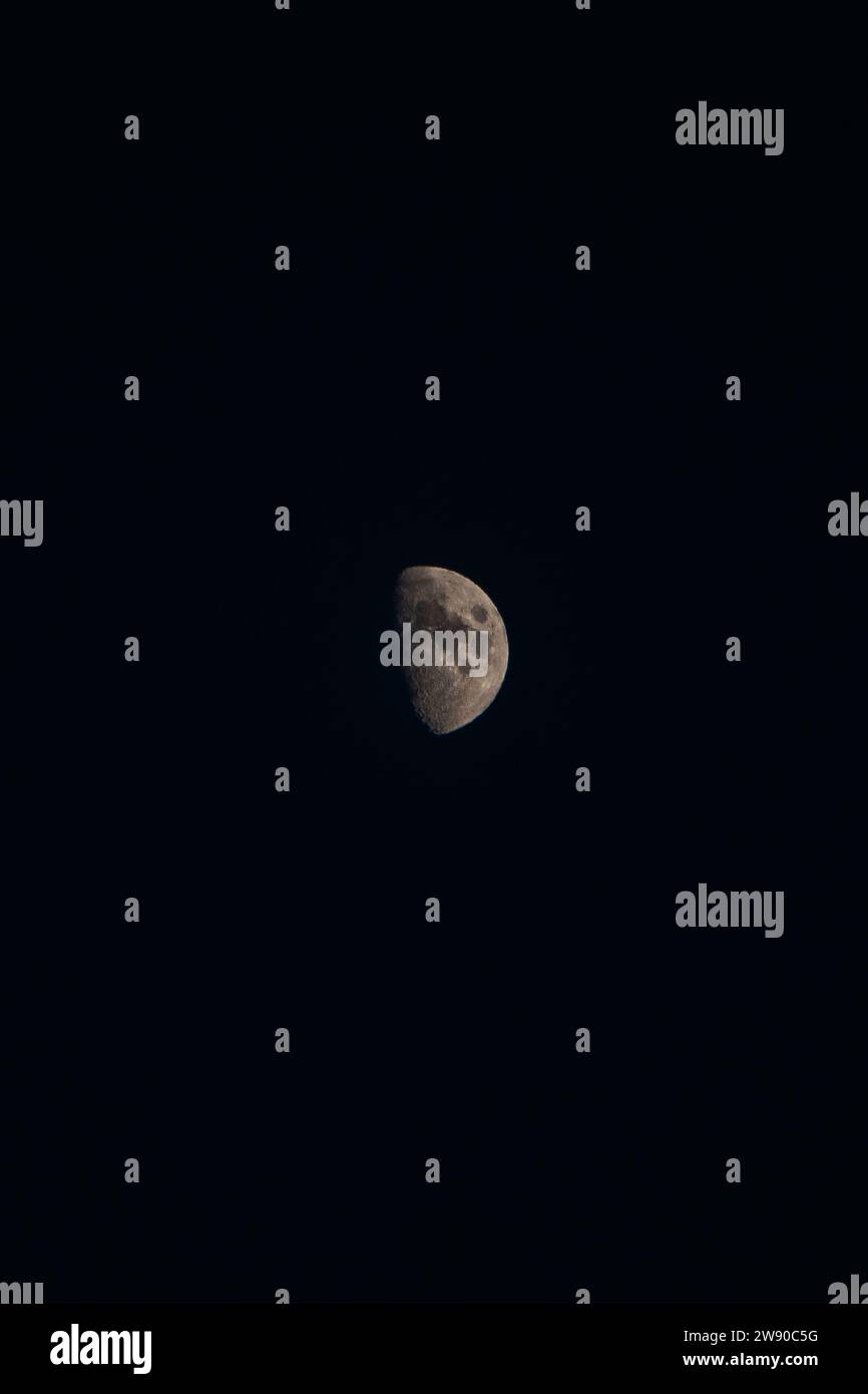 Moon in its full glory in a dark sky. Holes and depressions on an ...