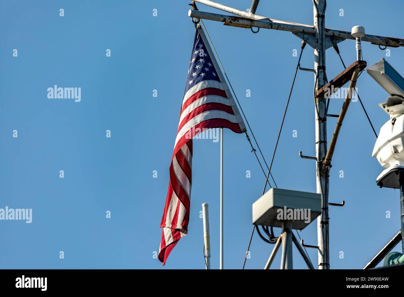 The great American flag, flying on the flagpole of an American ship ...