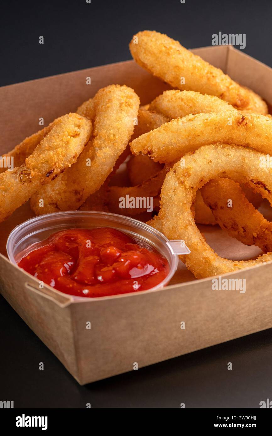 Golden crispy onion rings coated with breadcrumbs and deep fried. Fried ...