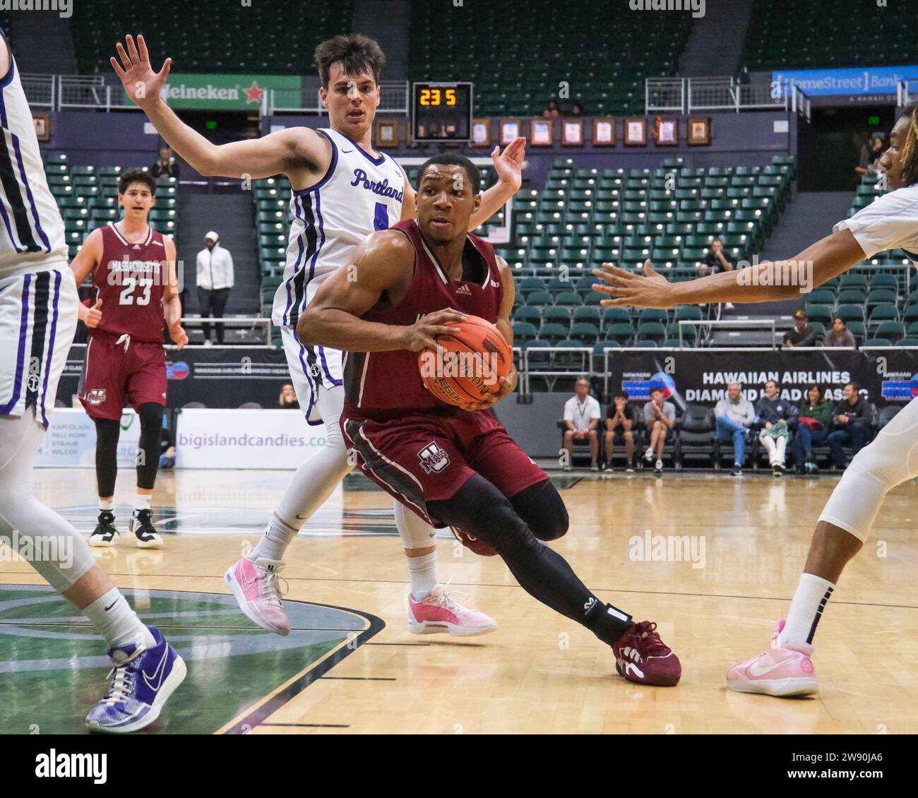 Honolulu, Hawaii, USA. 22nd Dec, 2023. Massachusetts guard Keon ...