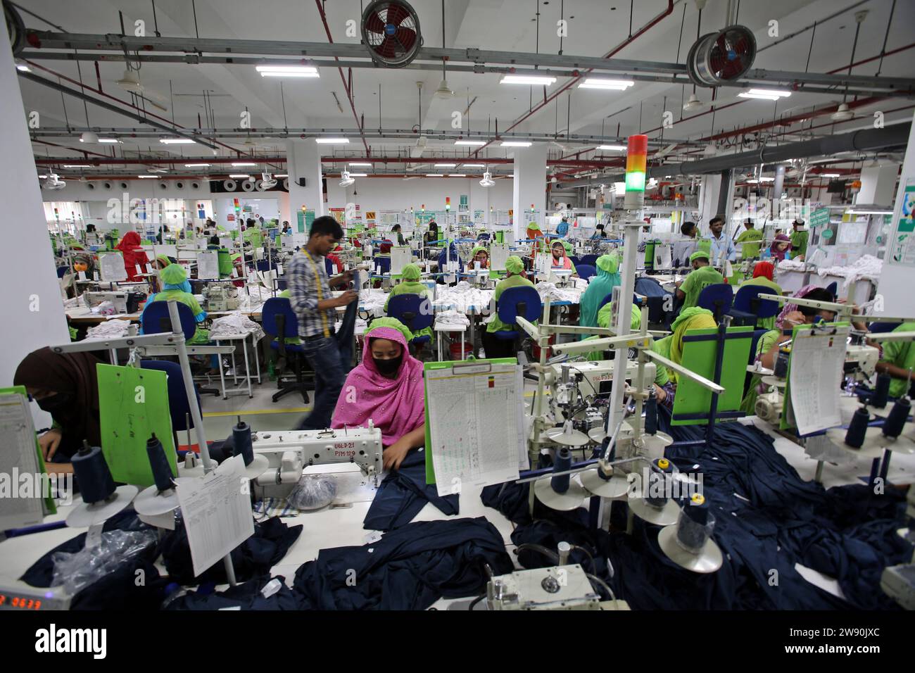 Ready-made garments worker works in a garments factory in Dhaka ...