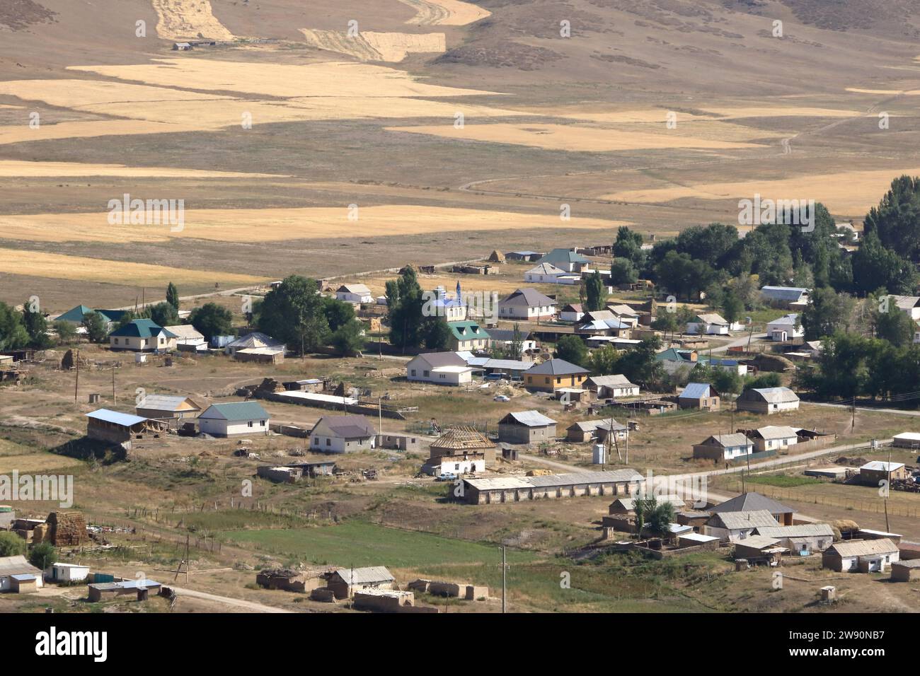 Mountain plateau over small village at road to Kazarman, district of ...