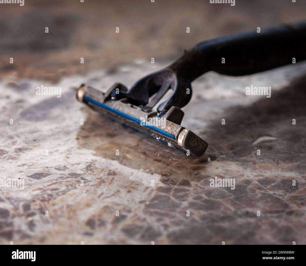 an old rusting desposable razor in a bathroom Stock Photo - Alamy