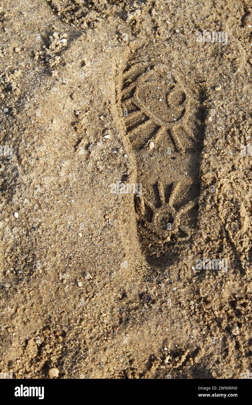Sand background wit pattern of boot print Stock Photo - Alamy
