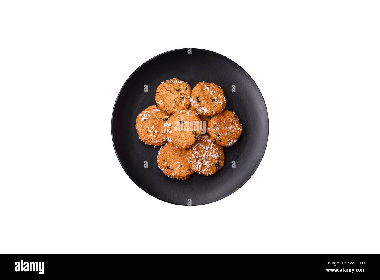 Delicious sweet round sponge cookies sprinkled with coconut flakes on a ...