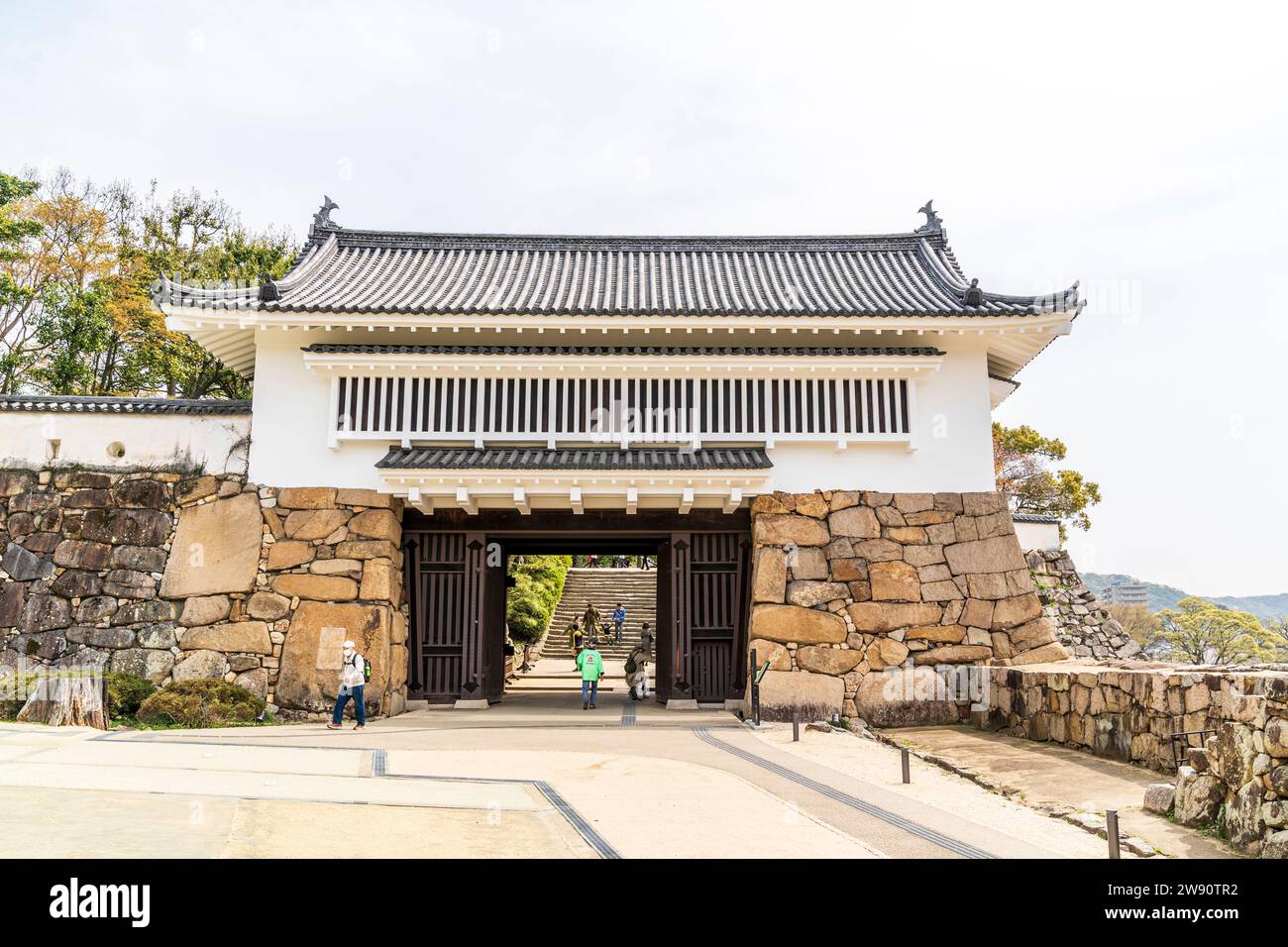 Ishigaki stone walls topped with white dobei plaster walls. and the ...
