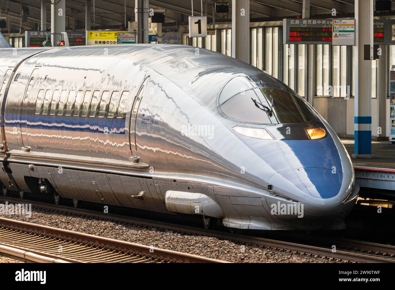 Japanese bullet train, shinkansen 500 series at Fukuyama station. Compressed perspective shot of ...