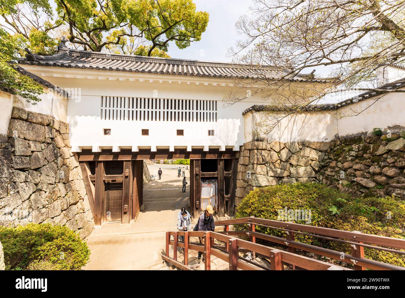 Ishigaki stone walls topped with white dobei plaster walls. and the ...