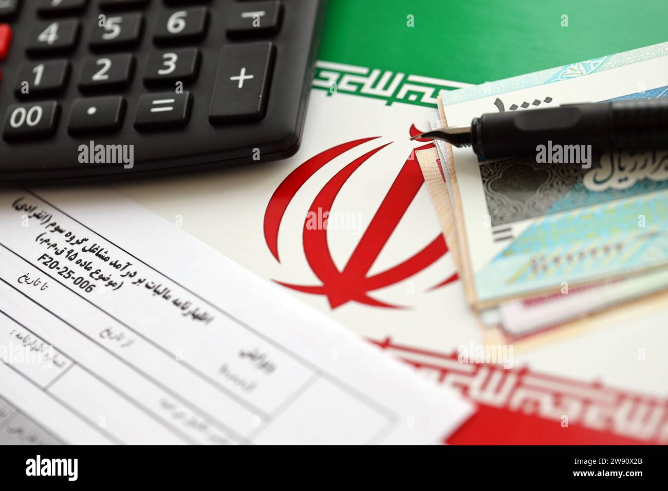 Iranian annual income tax return form F20-25-006 ready to fill on table ...