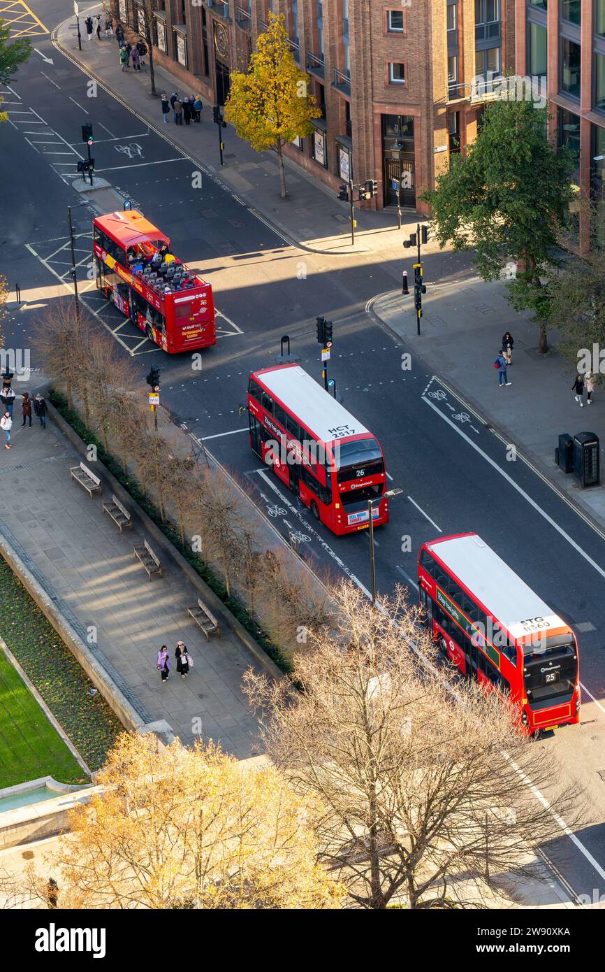 London, UK - 25 November 2023: A sightseeing open top bus and Transport ...