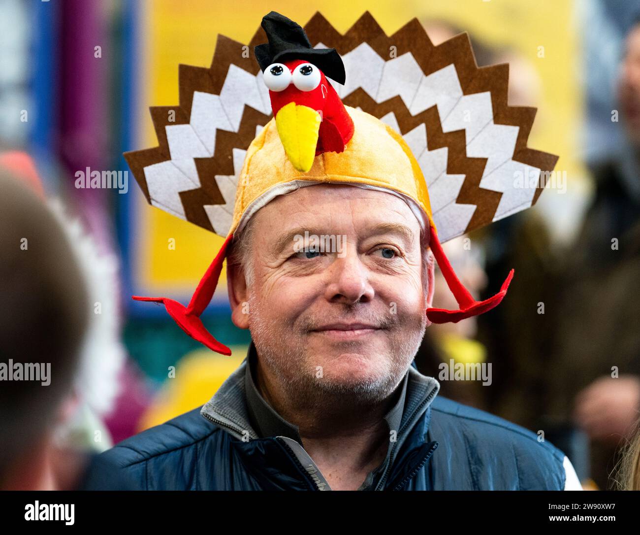 An event goer wears a turkey headpiece during the Smithfield Market ...
