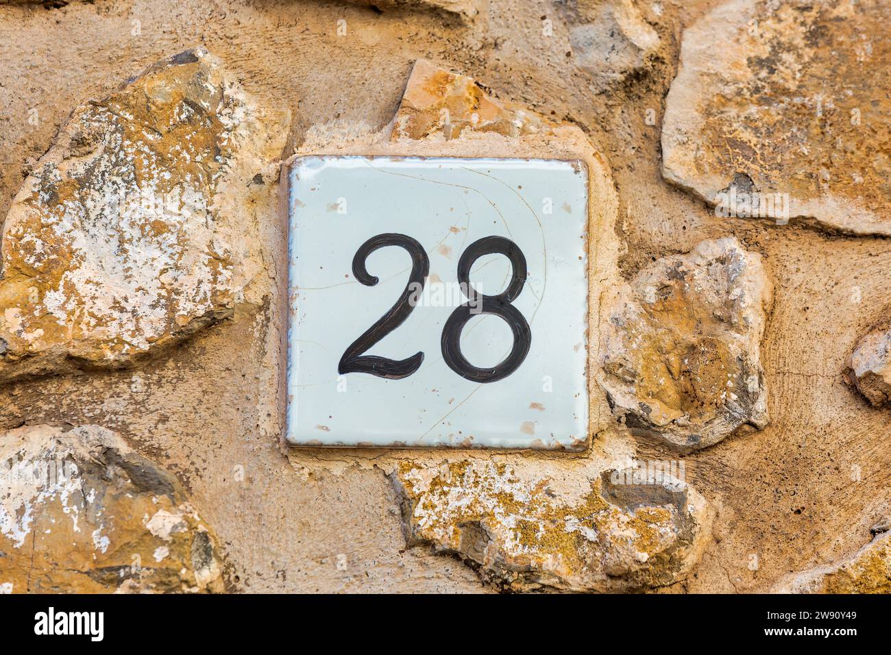 Old Weathered House Number 28, Tile on Wall Stock Photo - Alamy