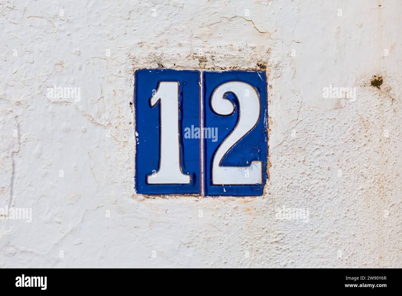 Old Weathered House Number 12, Tile on Wall Stock Photo - Alamy