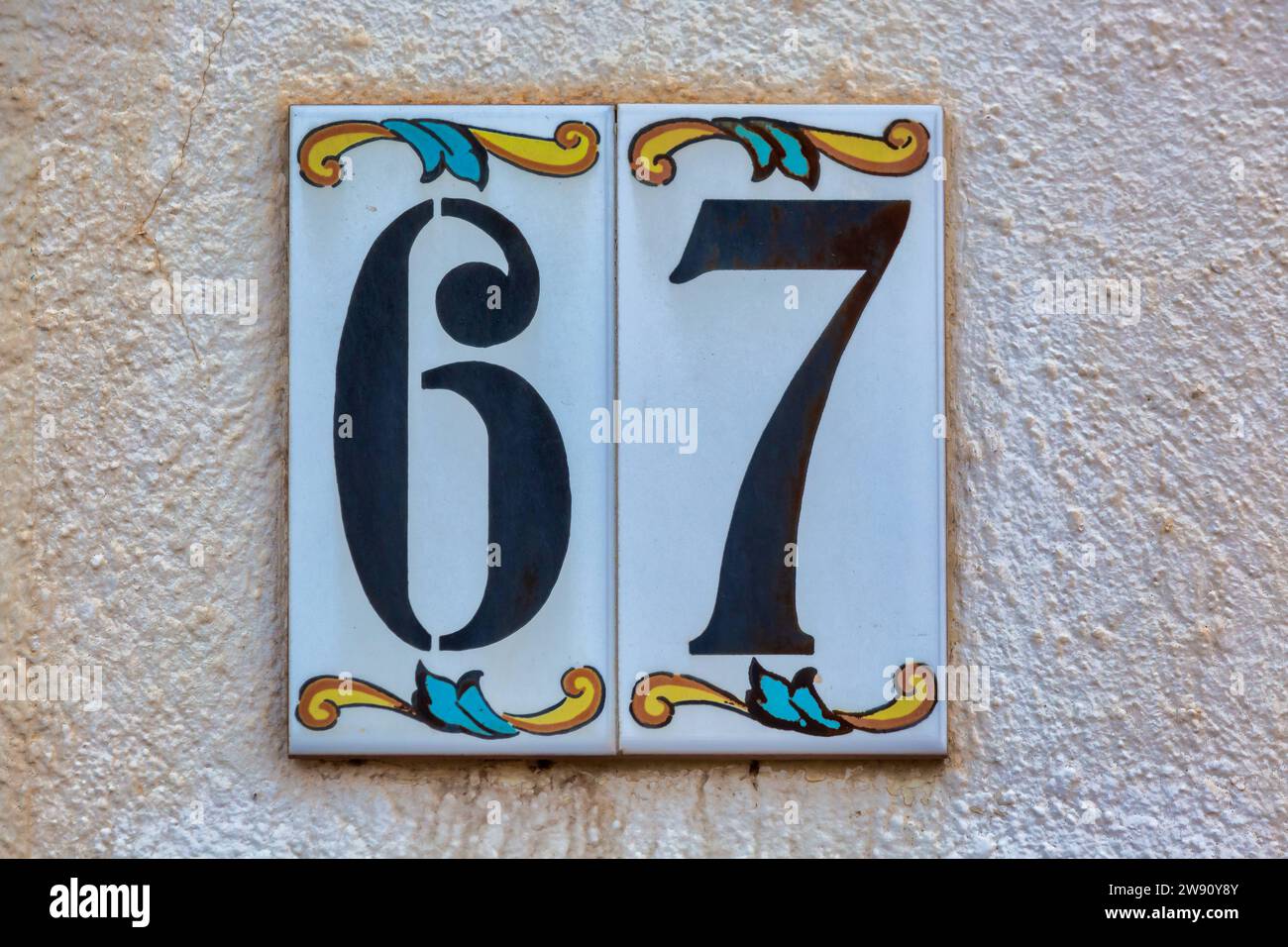 Old Weathered House Number 67, Tile on Wall Stock Photo - Alamy