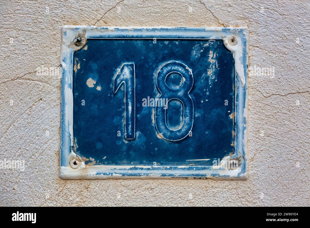 Old Weathered House Number 18, Tile on Wall Stock Photo - Alamy