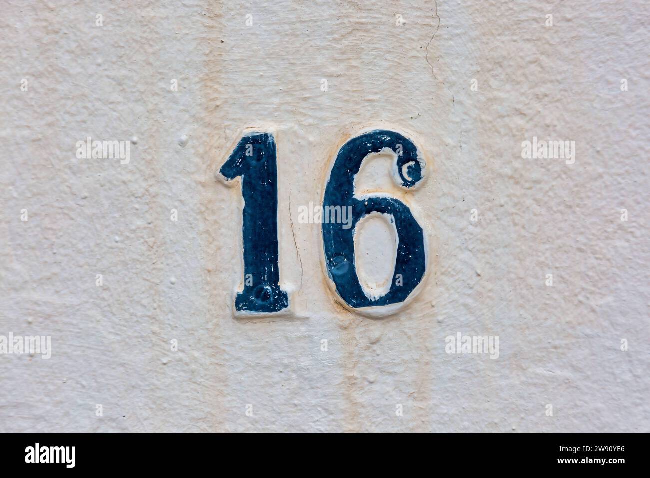 Old Weathered House Number 16, Tile on Wall Stock Photo - Alamy
