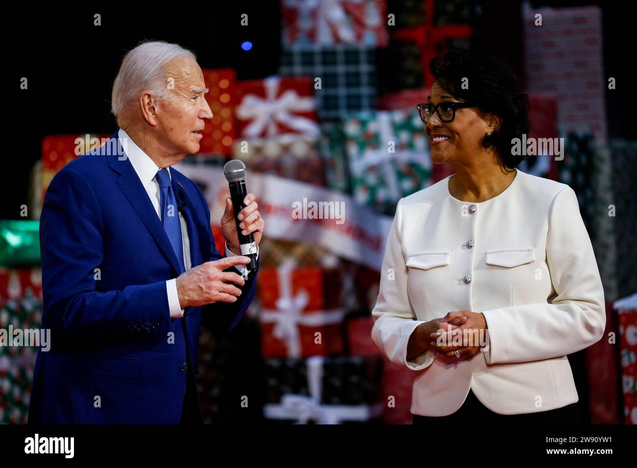 United States President Joe Biden talks to Michelle Riley-Brown, the ...