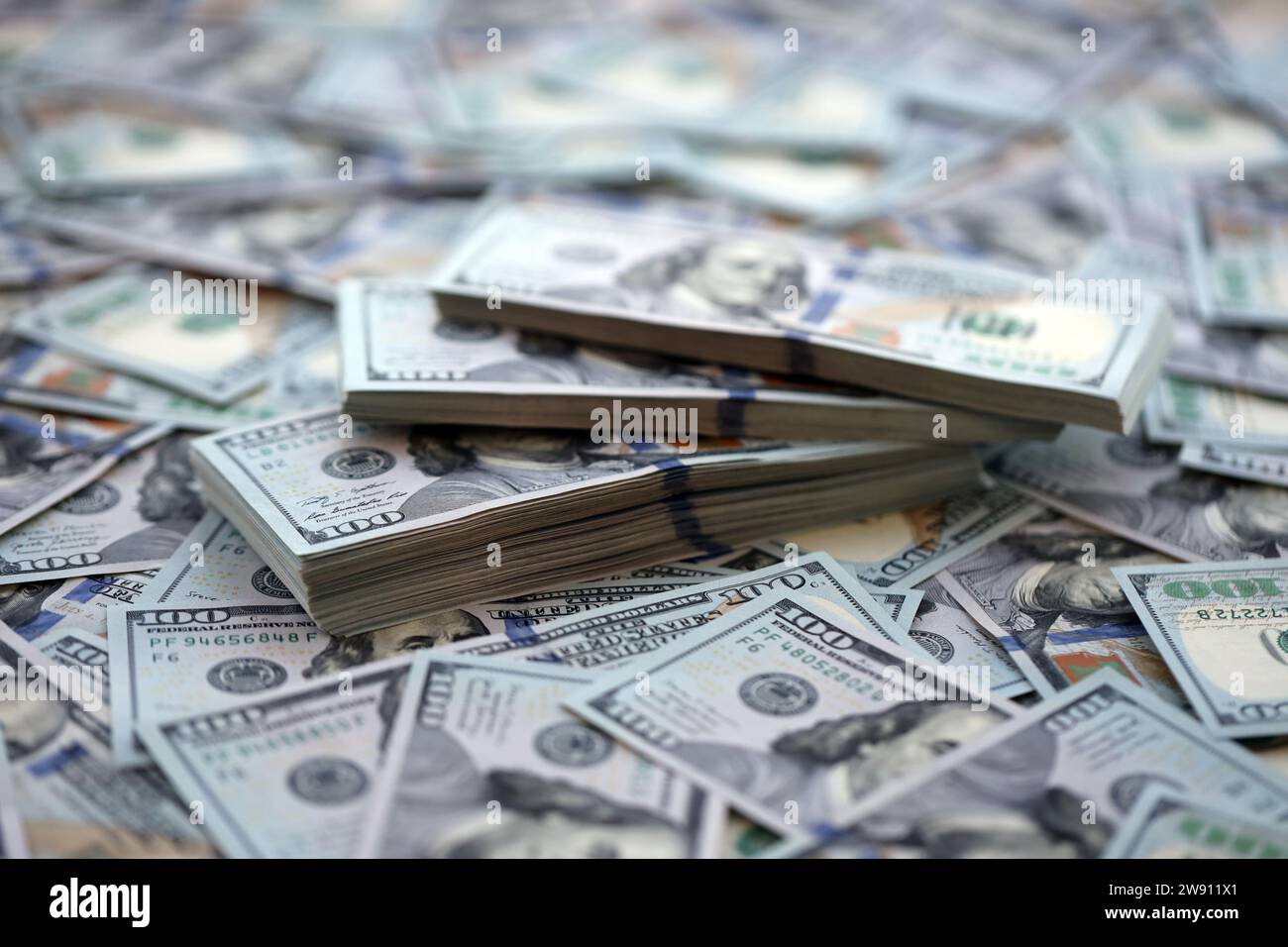 Very big amount of US hundred dollar bills close up. Huge quantity of ...