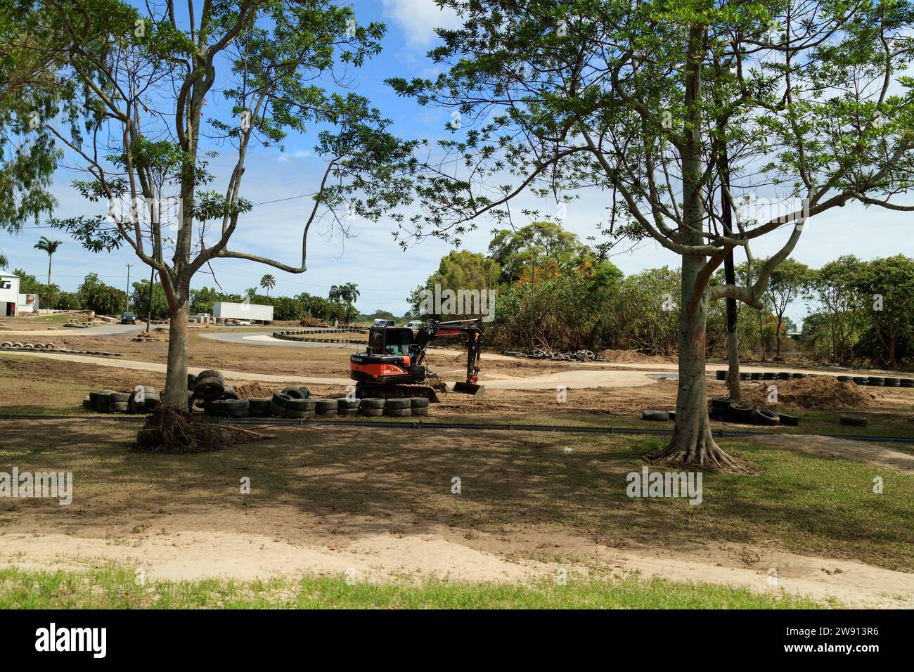 An excavator works to remove debris near a go kart track and Thomatis ...