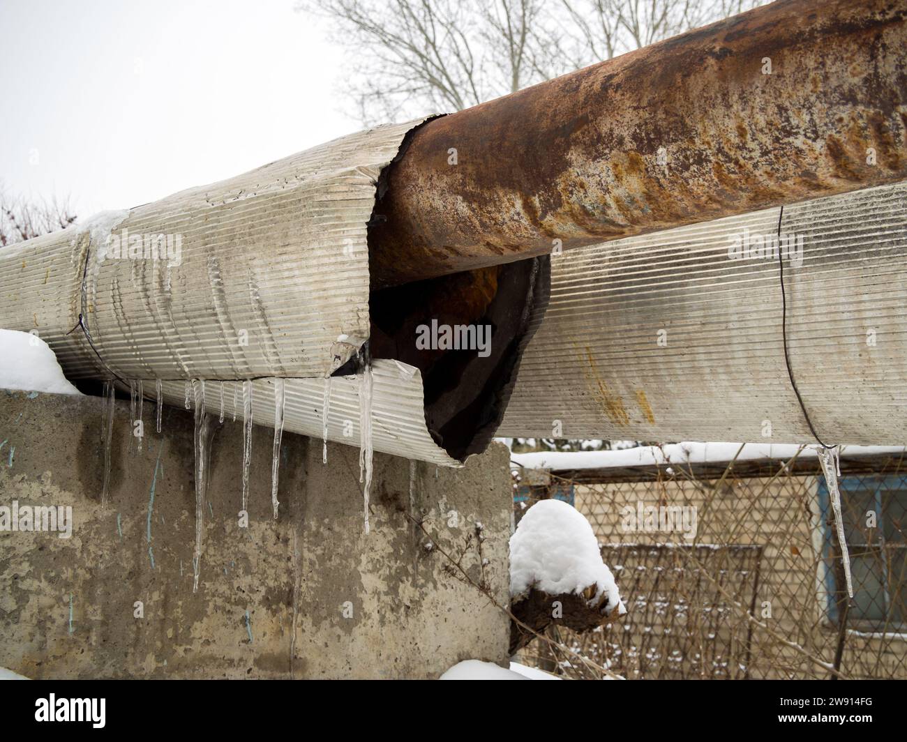 Broken thermal insulation of the heating pipe Stock Photo - Alamy