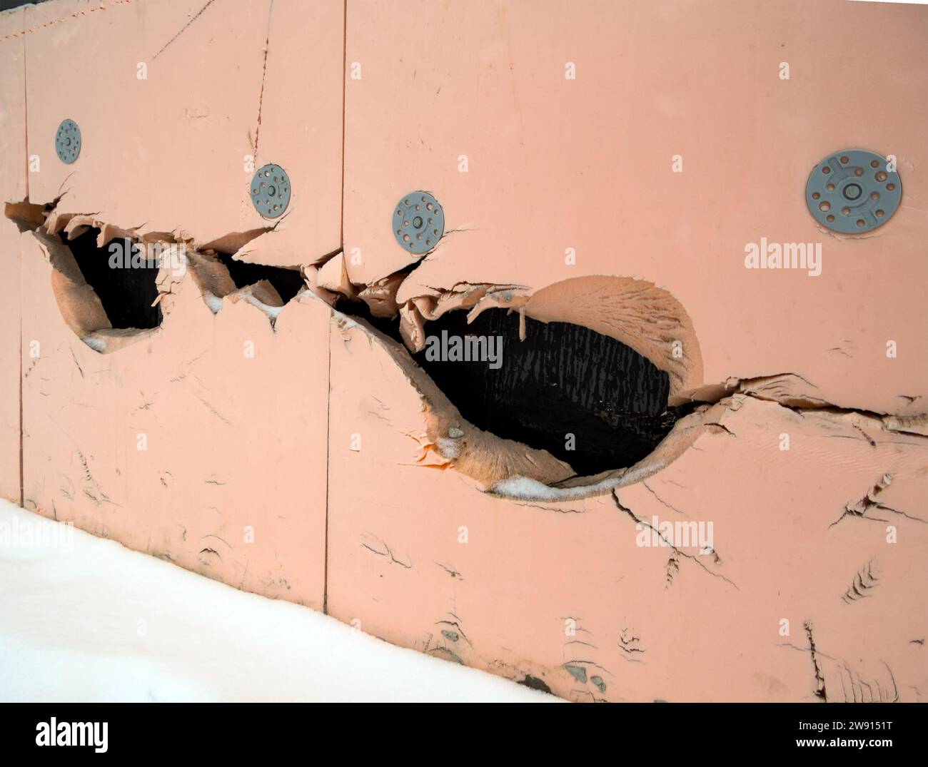 Mechanical damage to the insulation on the wall of the building Stock ...