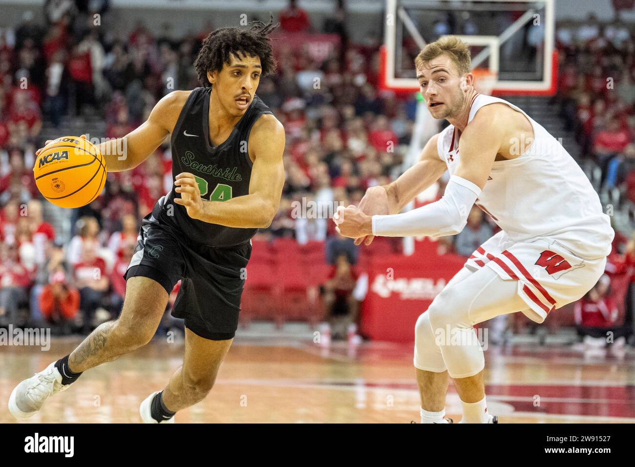 Chicago State's Jahsean Corbett (24) against Wisconsin's Tyler Wahl (5 ...