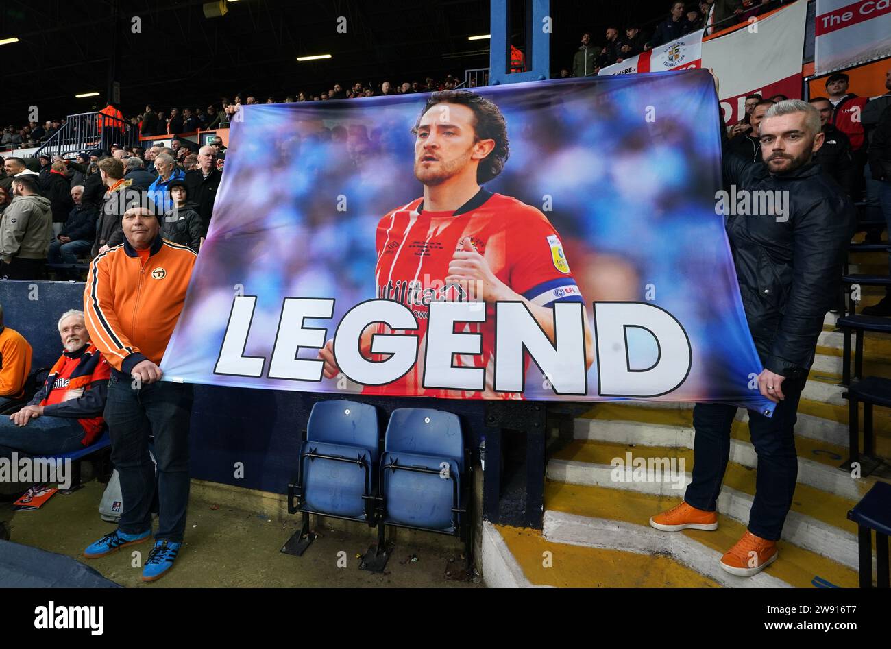Luton Town fans hold up a banner of support for Tom Lockyer during the ...