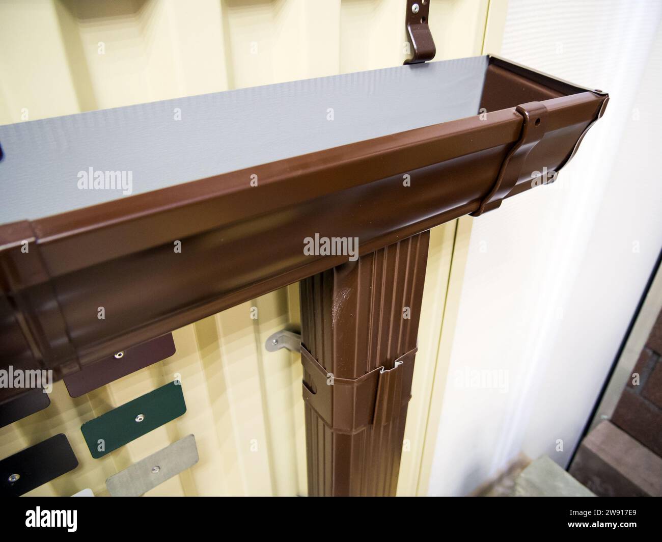 Fragment of a sample of a metal gutter system Stock Photo - Alamy