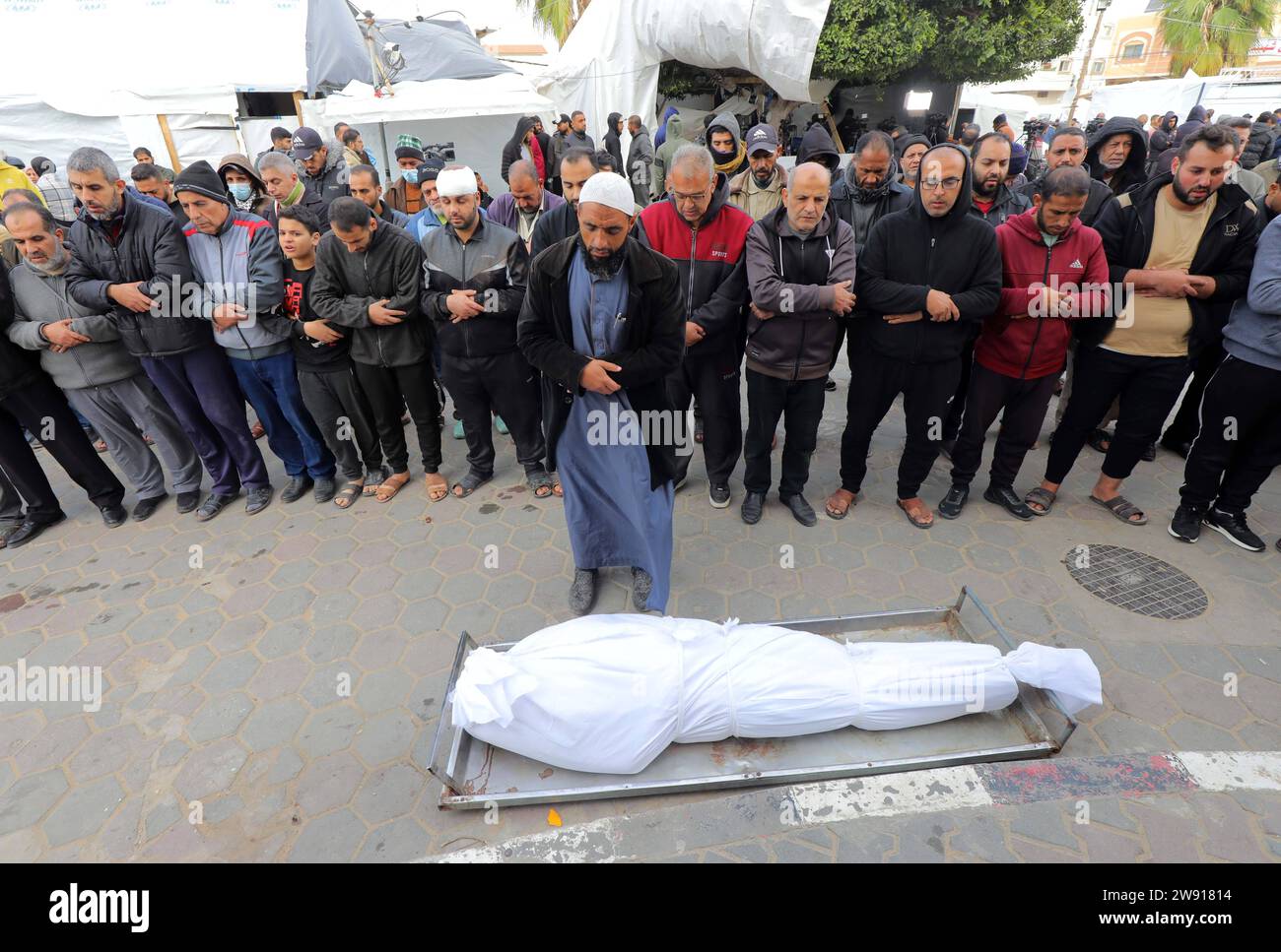 Relatives of the Palestinians died in Israeli attacks, mourn as they ...