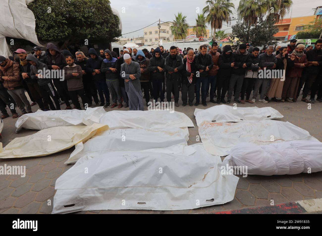 Relatives of the Palestinians died in Israeli attacks, mourn as they ...