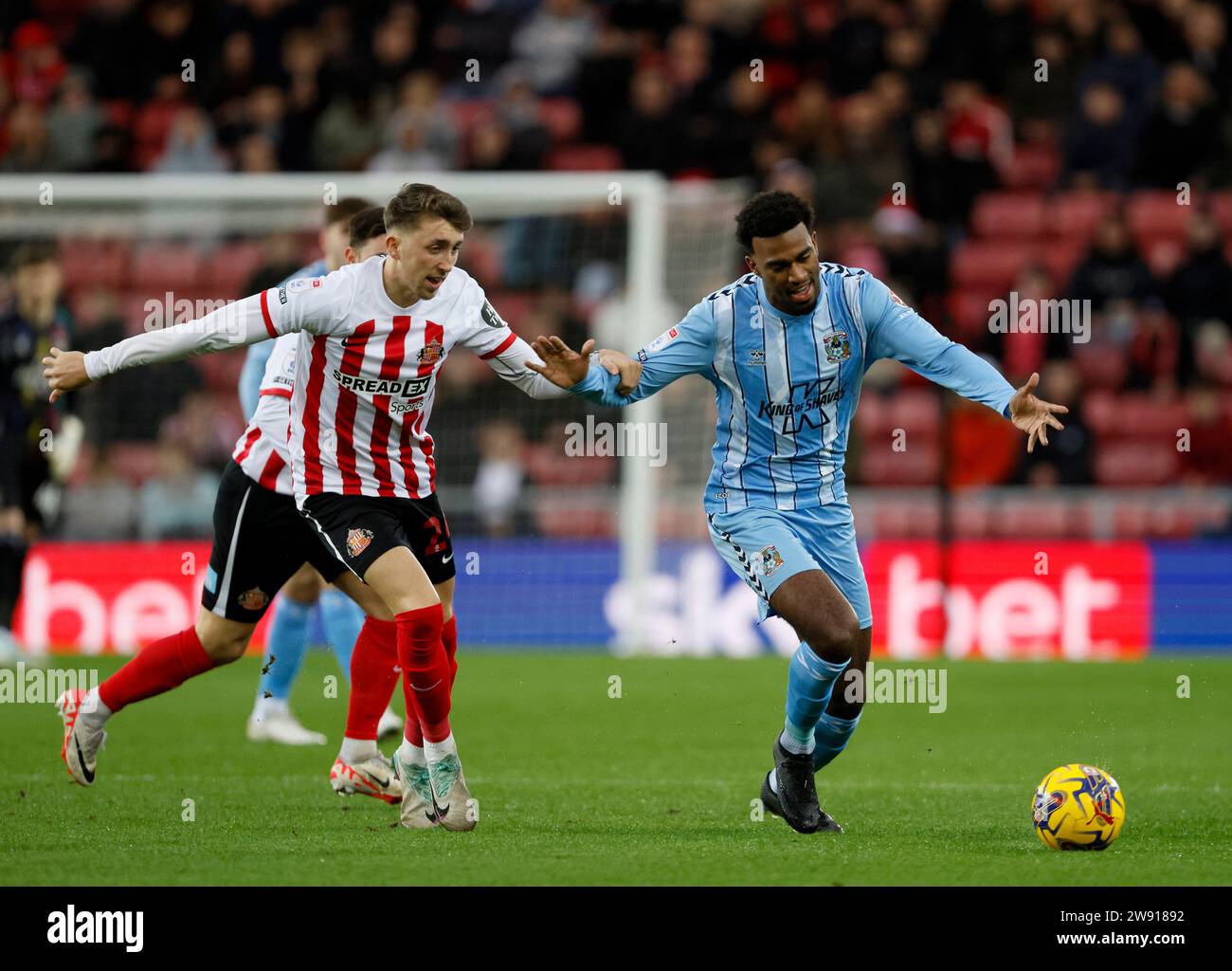 Sunderland's Dan Neil (left) and Coventry City's Haji Wright battle for ...