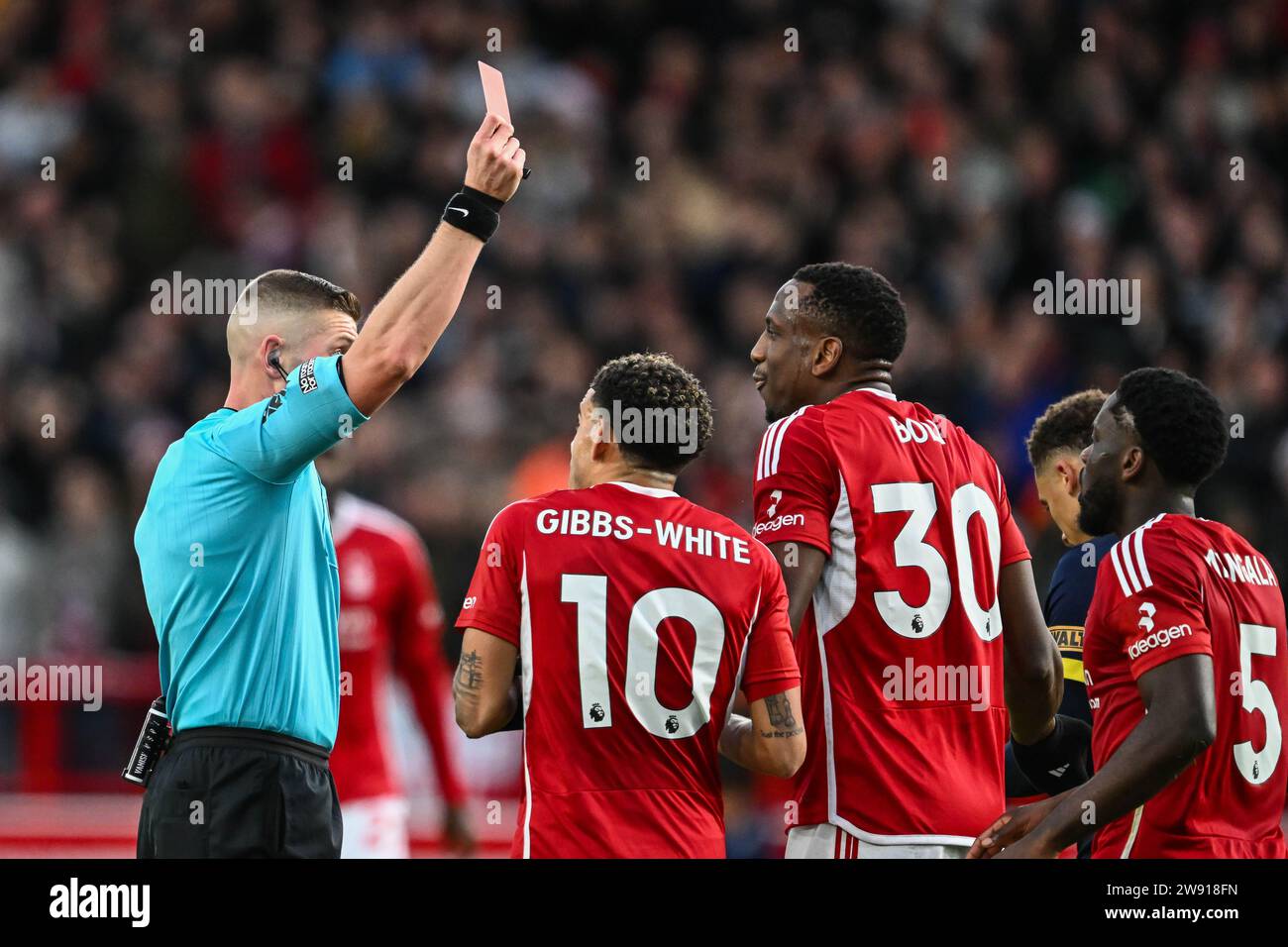 Nottingham, UK. 23rd Dec 2023. Referee Robert Jones gives a red card to ...