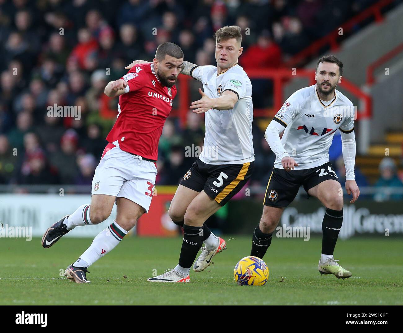 Wrexham’s Elliot Lee (left) is challenged by Newport County’s James ...