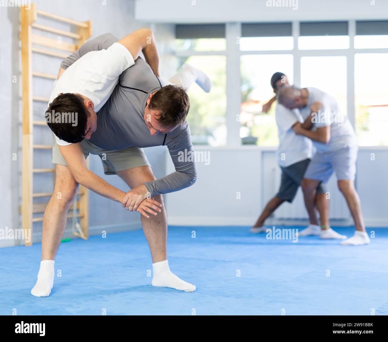 Two men training judo technique in studio Stock Photo - Alamy
