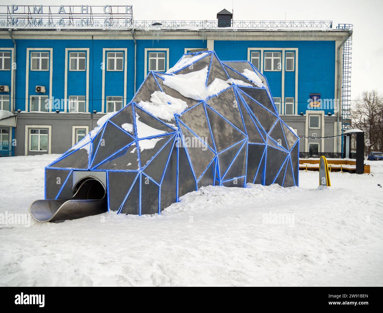 Murmansk, Russia - February 27, 2022: Children's ice slide in the form ...