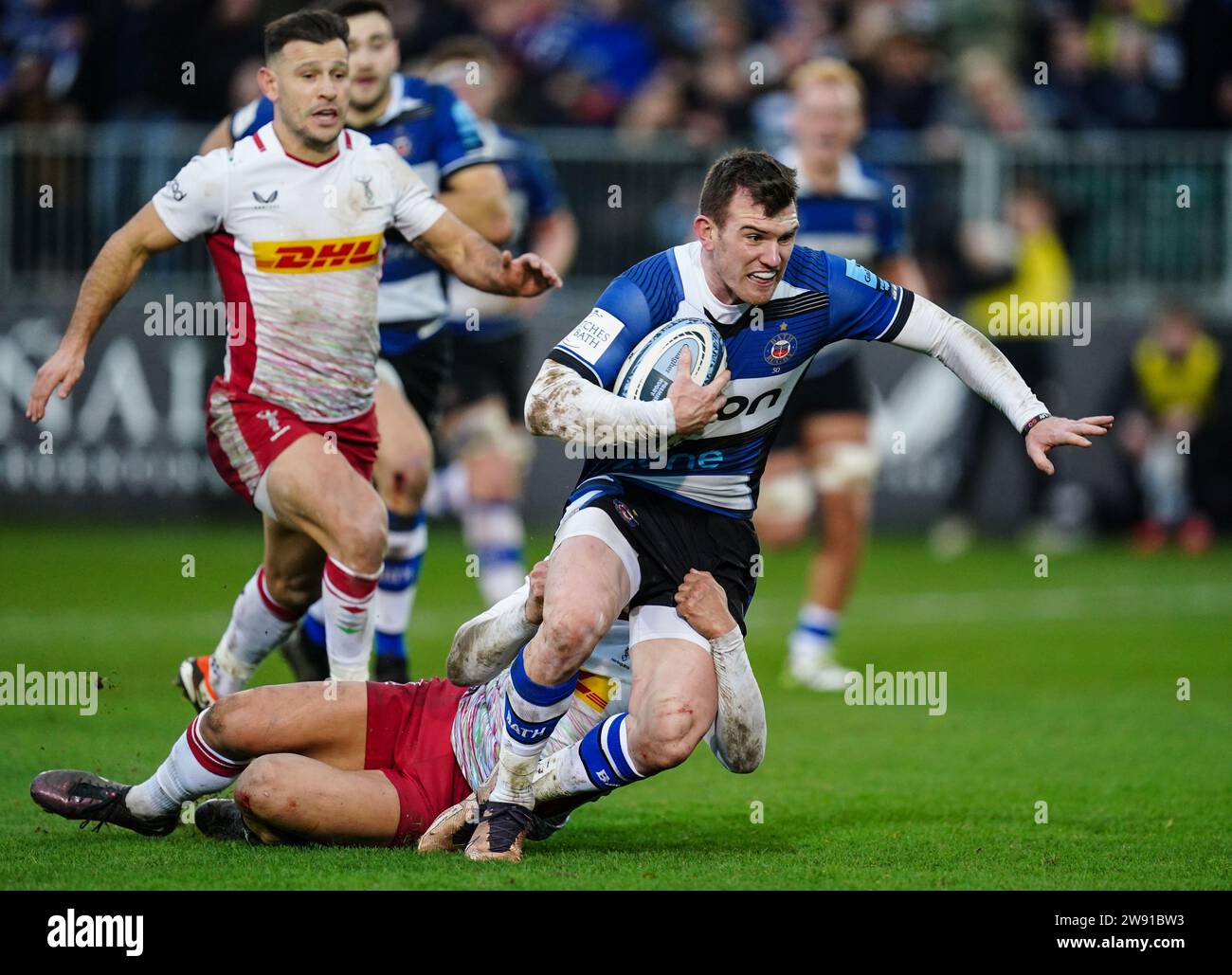 Bath's Ben Spencer is tackled by Harlequins Nick David during the ...