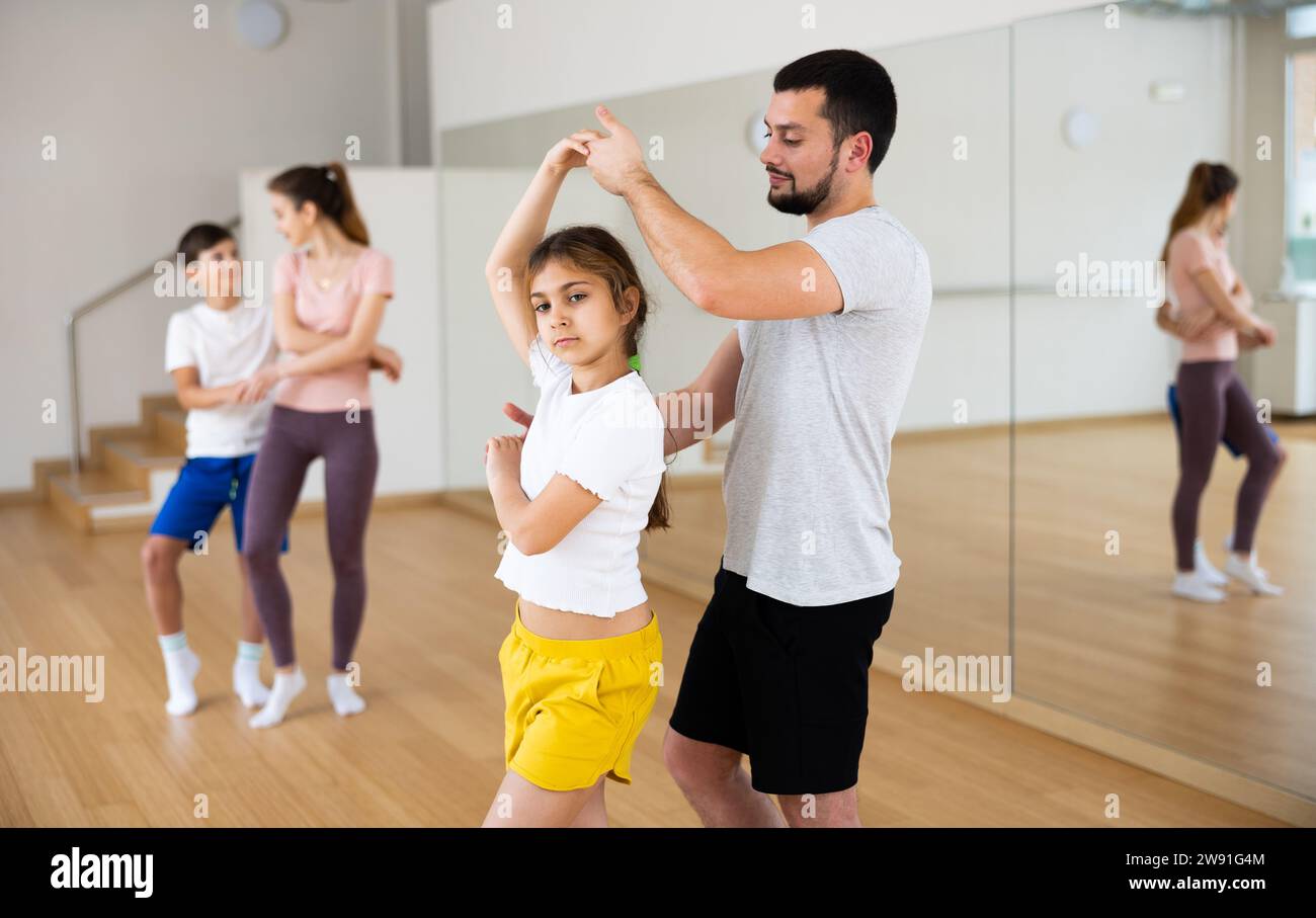 Man dancing with daughter at dance class Stock Photo - Alamy